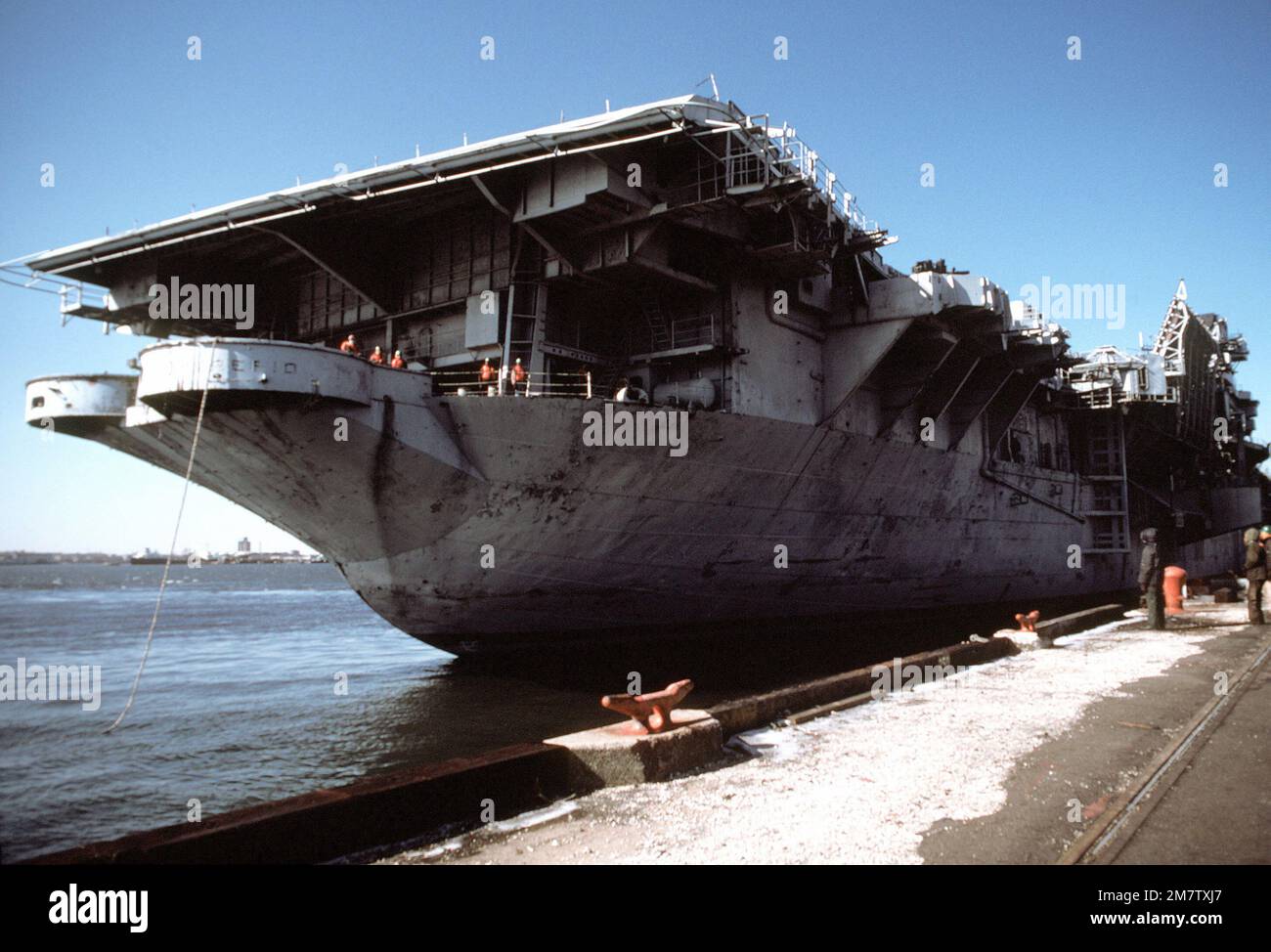A starboard quarter view of the docked anti-submarine warfare support aircraft carrier ex-USS ...
