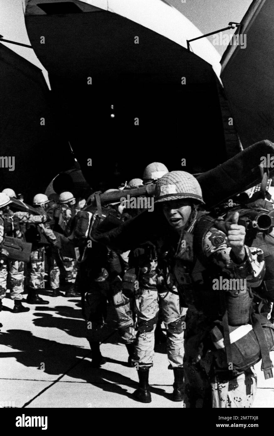 SPC Patrick McGinnis, 2nd Bn., 504th Inf., 82nd Abn., Div., gives ...