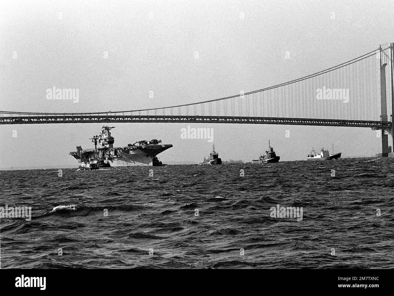 A starboard bow view of the towed aircraft carrier ex-USS INTREPID (CVS ...