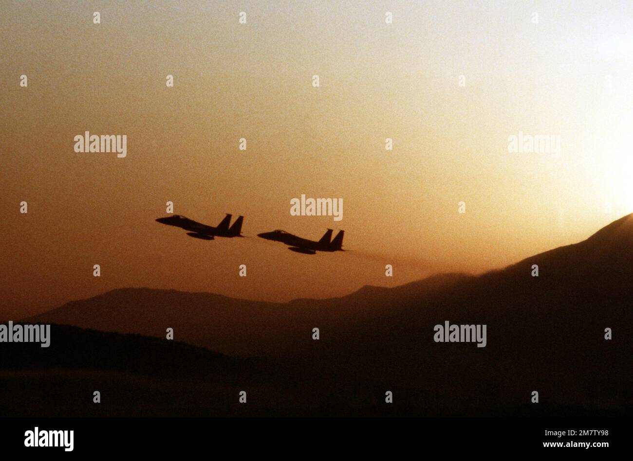 Two F-15 Eagle aircraft from the 18th Tactical Fighter Wing take off ...