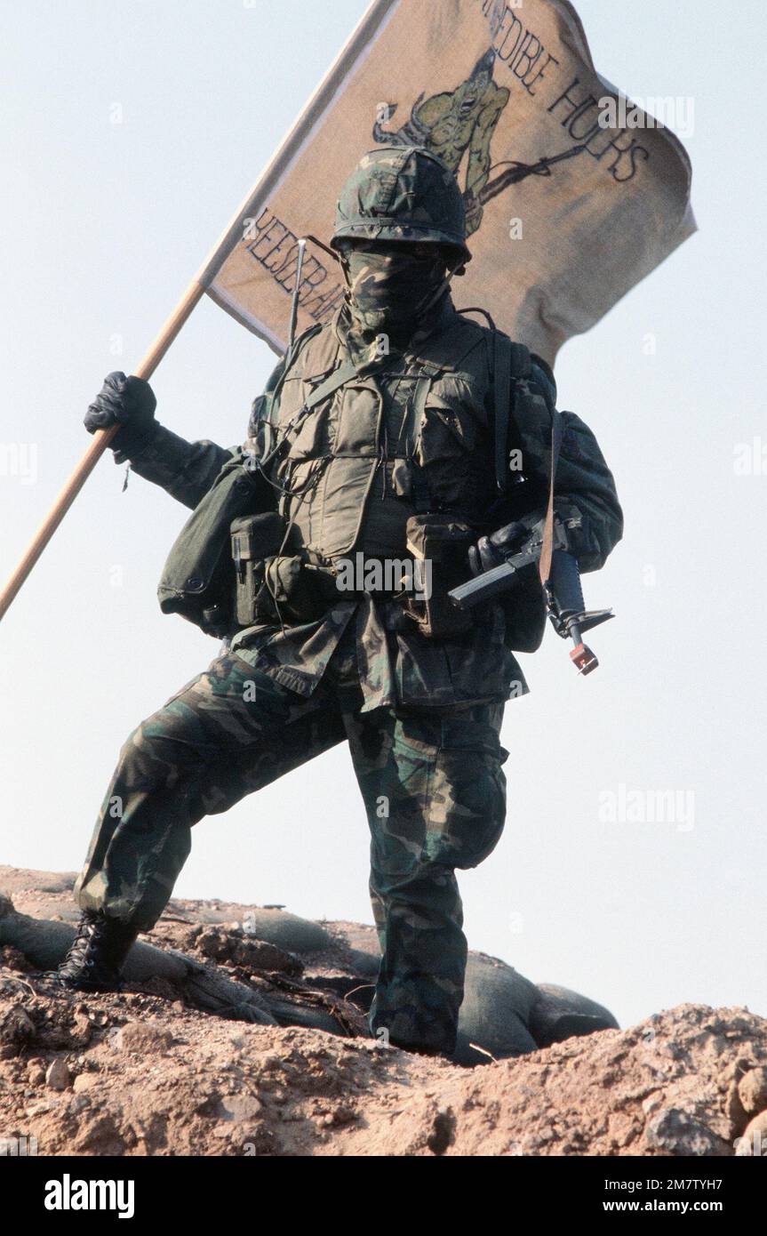 SGT John Campbell, 3380th Security Police Squadron, stands on top of a ...
