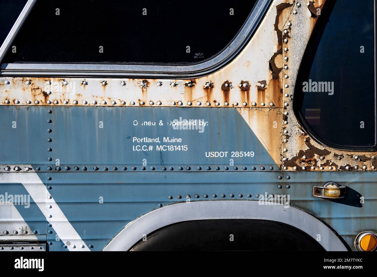 window and rusted siding from old blue and white transit bus Stock ...
