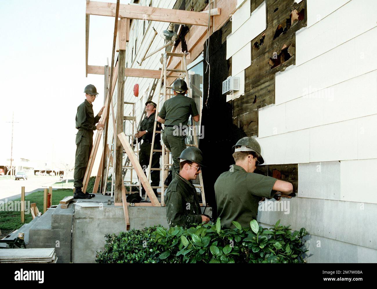 Seabees from Construction Battalion 416 add new siding and a porch roof ...