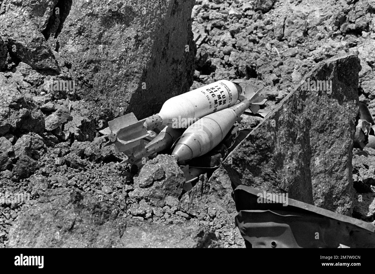 Several mortar rounds, with an explosive charge placed between them ...