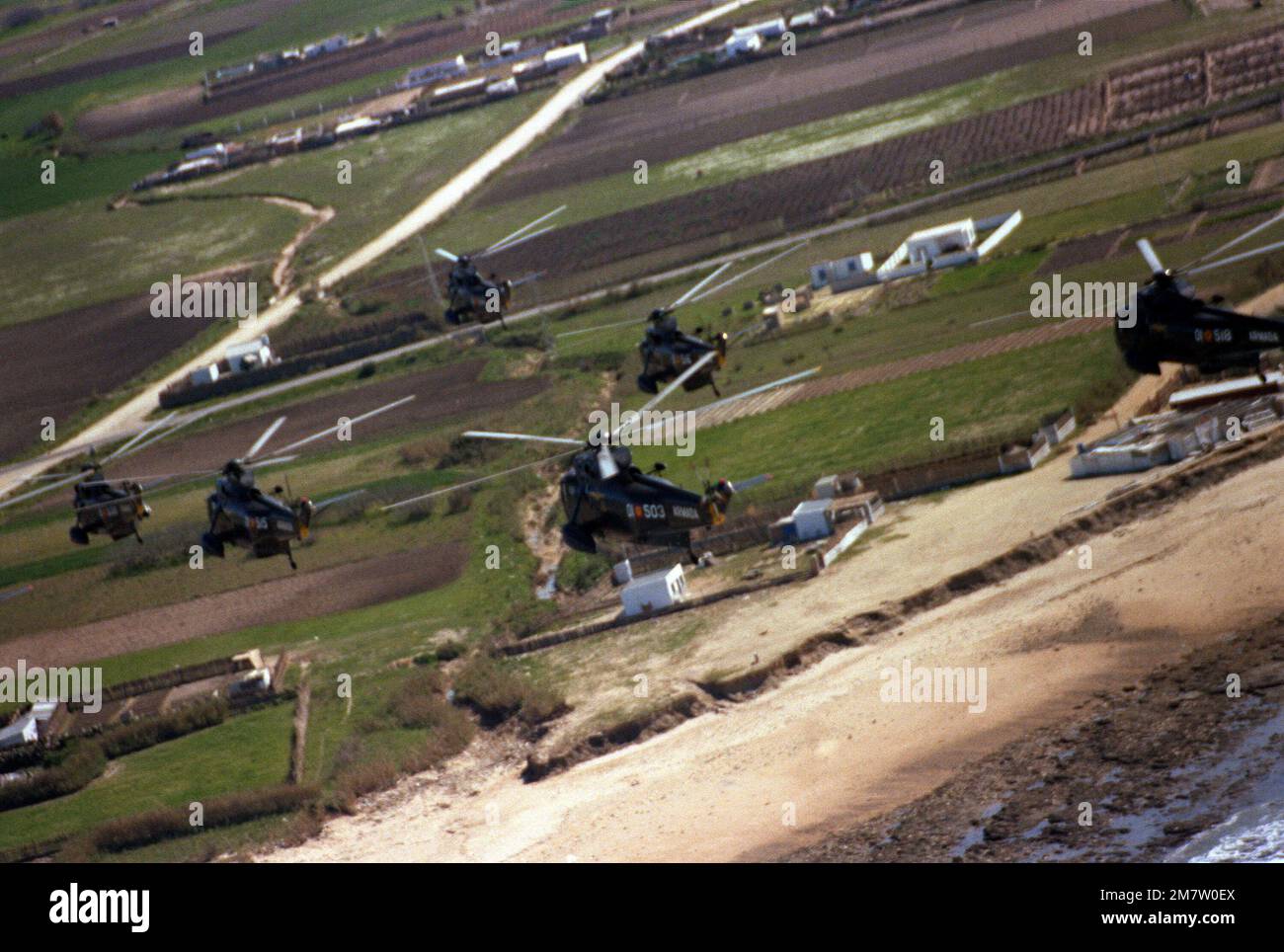 Spanish helicopters fly in formation. (Substandard image). Base: Rota ...