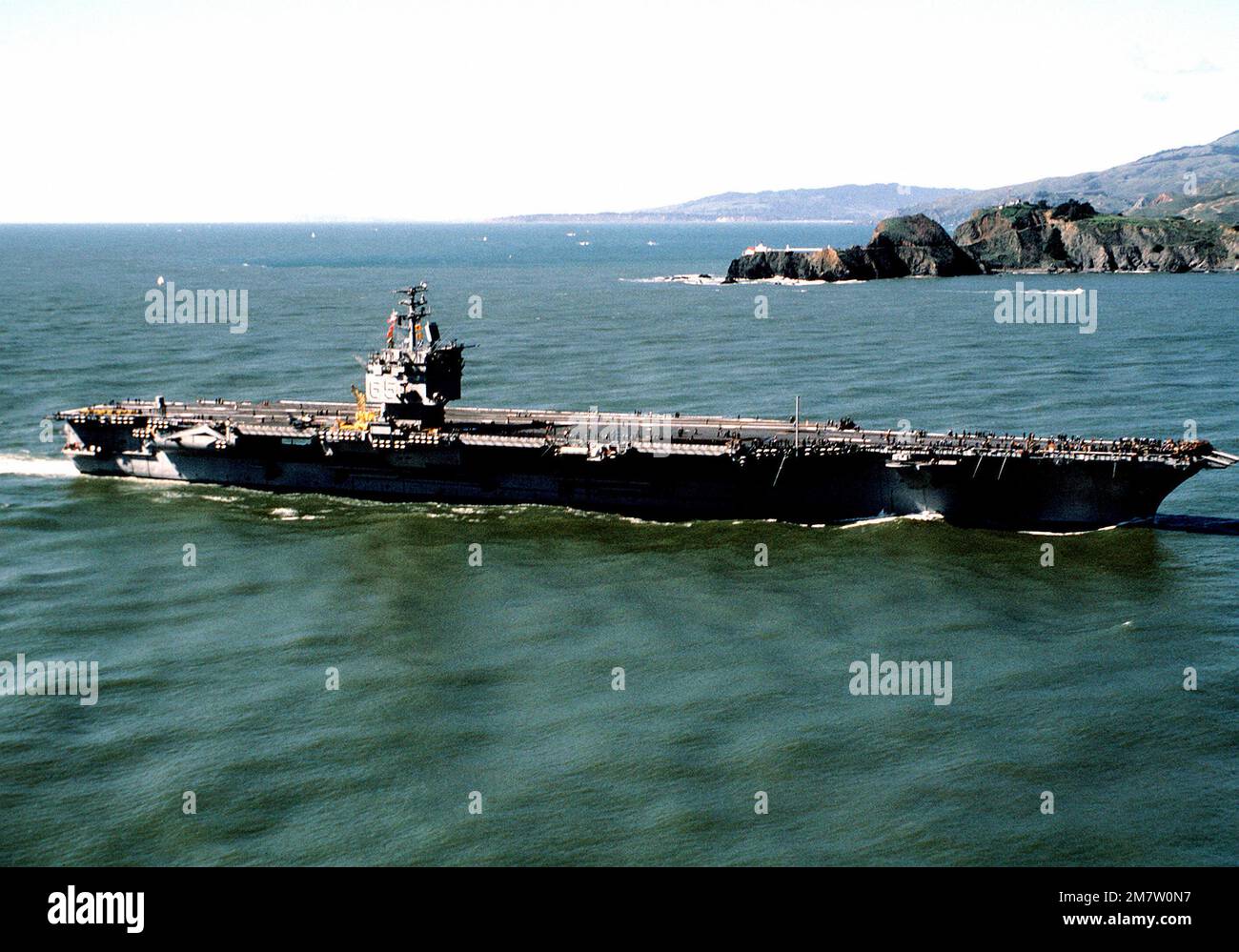 A starboard beam view of the nuclear-powered aircraft carrier USS ...