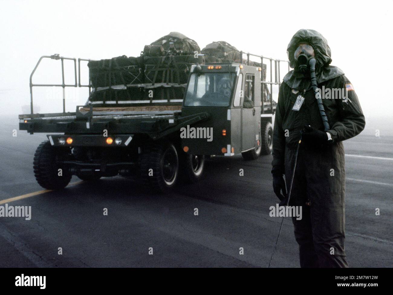 Loadmasters and Aerial Port personnel prepare to upload equipment while ...