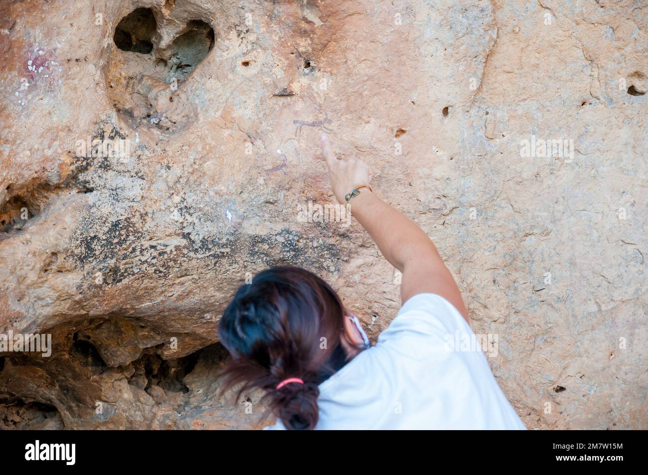 guide showing the cave paintings of Abrics de l'Ermita, the most ...