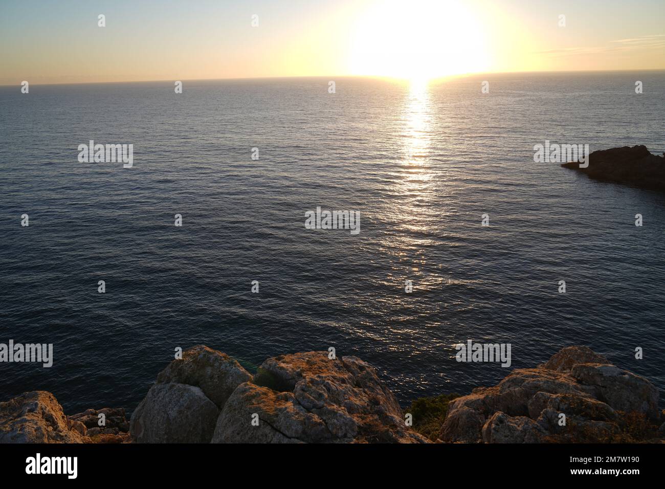 A beautiful view of ocean water during sunset Stock Photo - Alamy