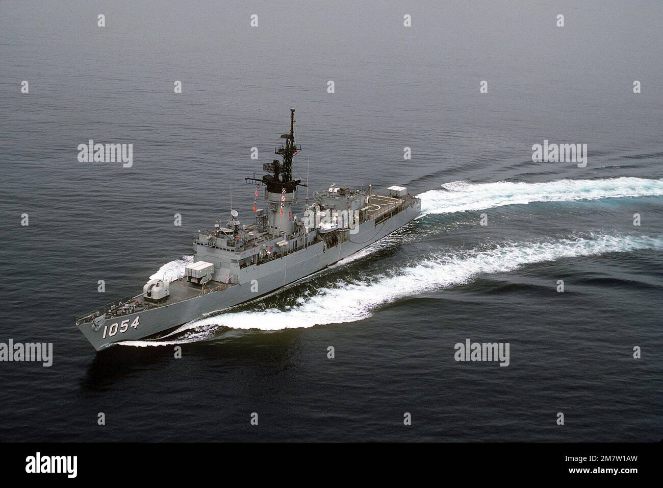 A port bow view of the Knox Class frigate USS GRAY (FF-1054) executing ...