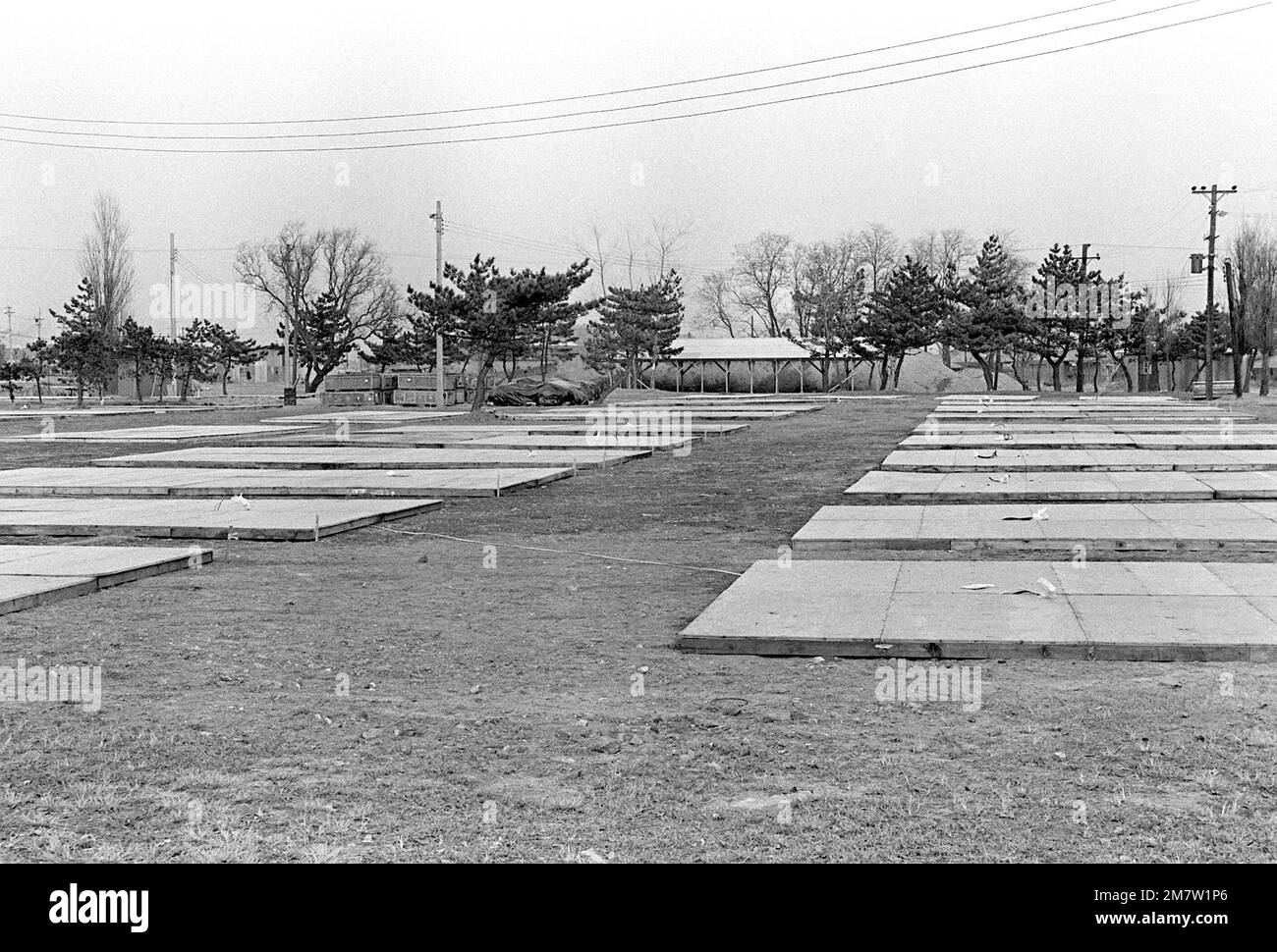 A vacant lot is turned into a tent city. The foundations are all in ...
