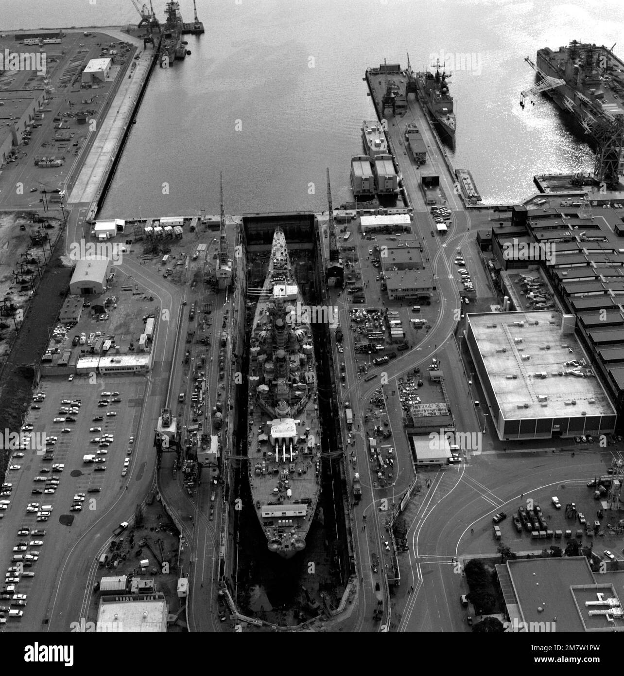 An aerial stern view of the battleship NEW JERSEY (BB-62) in drydock ...