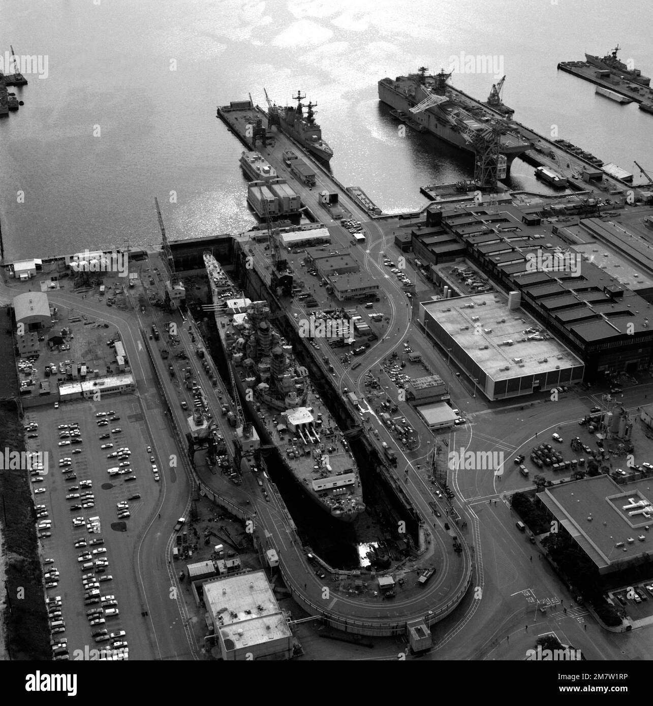 An aerial stern view of the battleship NEW JERSEY (BB-62) in drydock ...