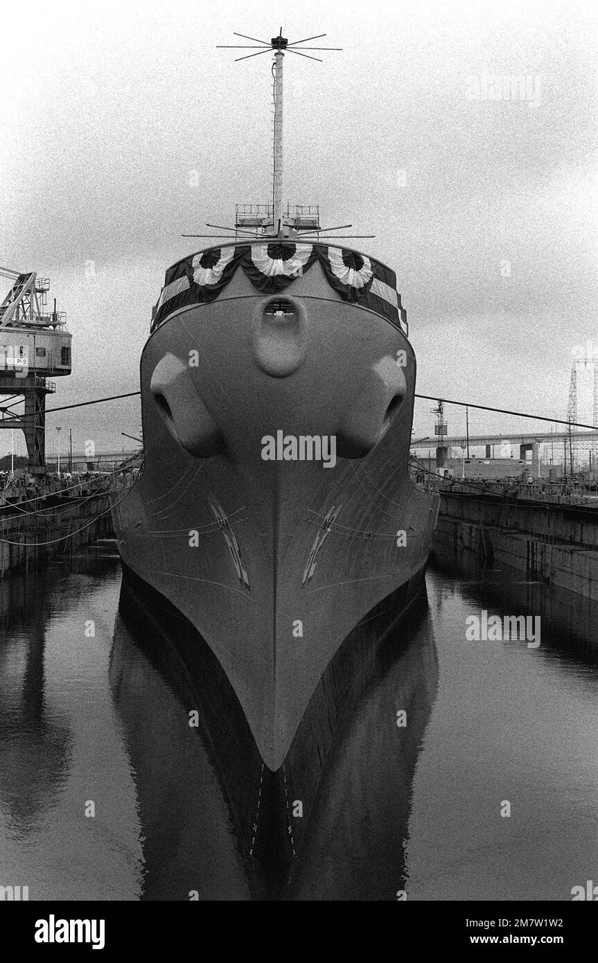 A bow view of the battleship NEW JERSEY (BB-62) afloat in a drydock ...