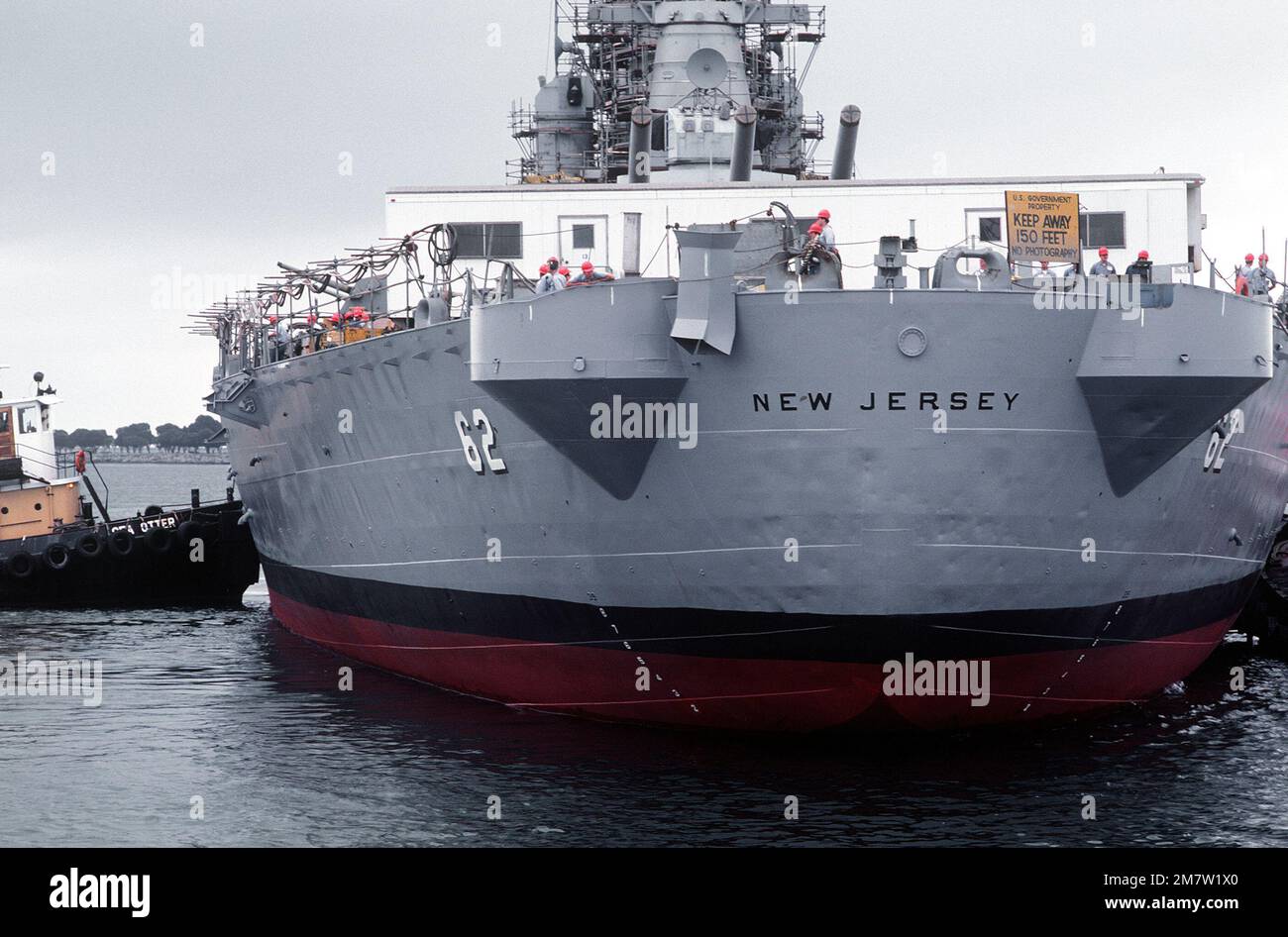 A stern view of the battleship NEW JERSEY (BB-62) as the ship leaves a ...
