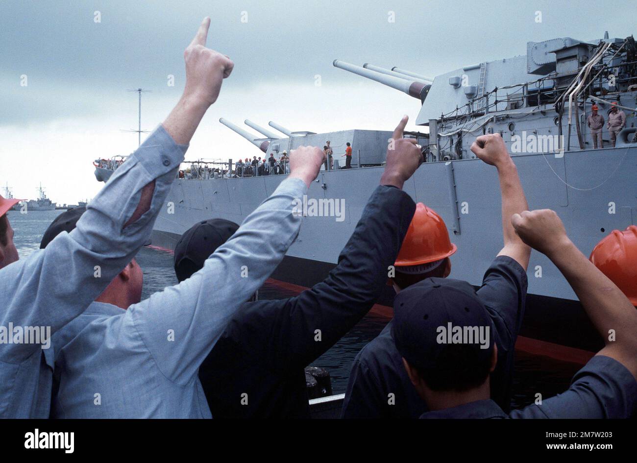 Naval shipyard workers cheer as the battleship NEW JERSEY (BB-62 ...