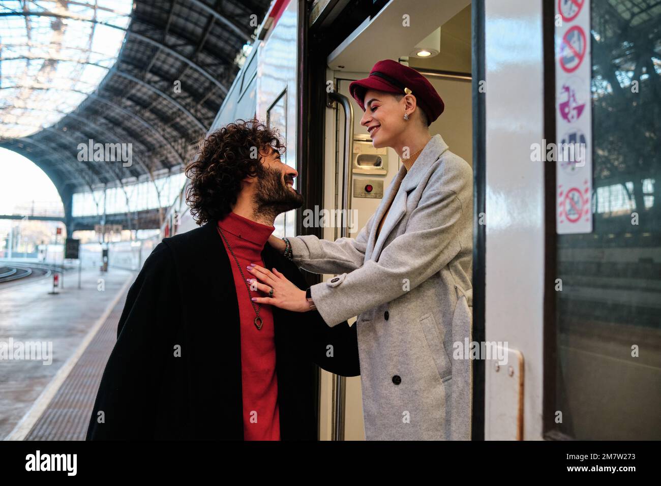 Couple saying goodbye in a train station Stock Photo - Alamy
