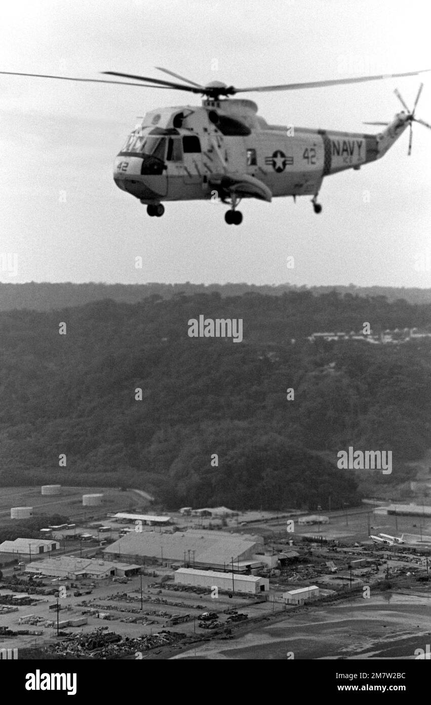 An air-to-air left front view of an SH-3 Sea King helicopter from Fleet ...