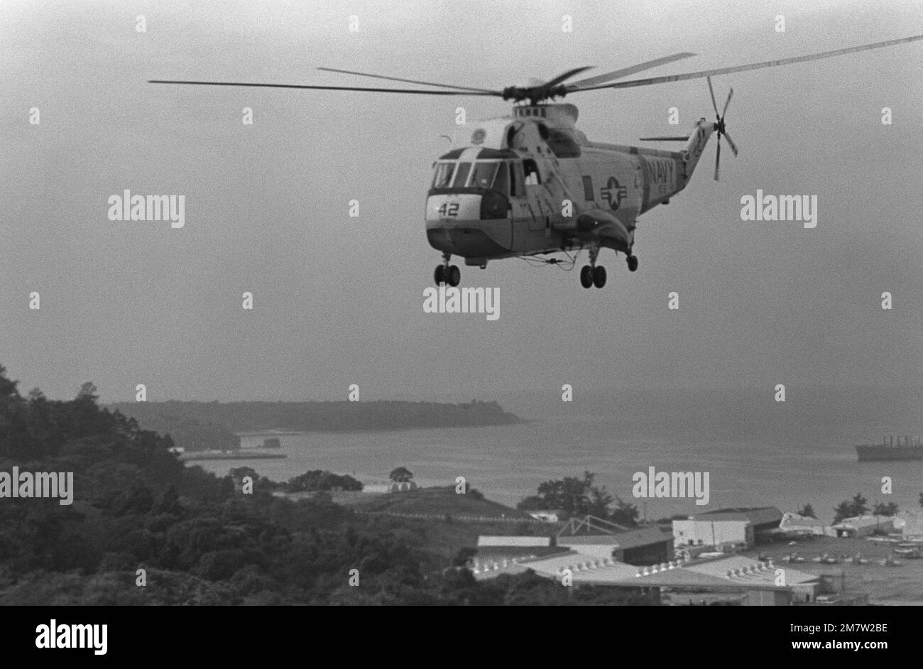 An air-to-air left front view of an SH-3 Sea King helicopter from Fleet ...