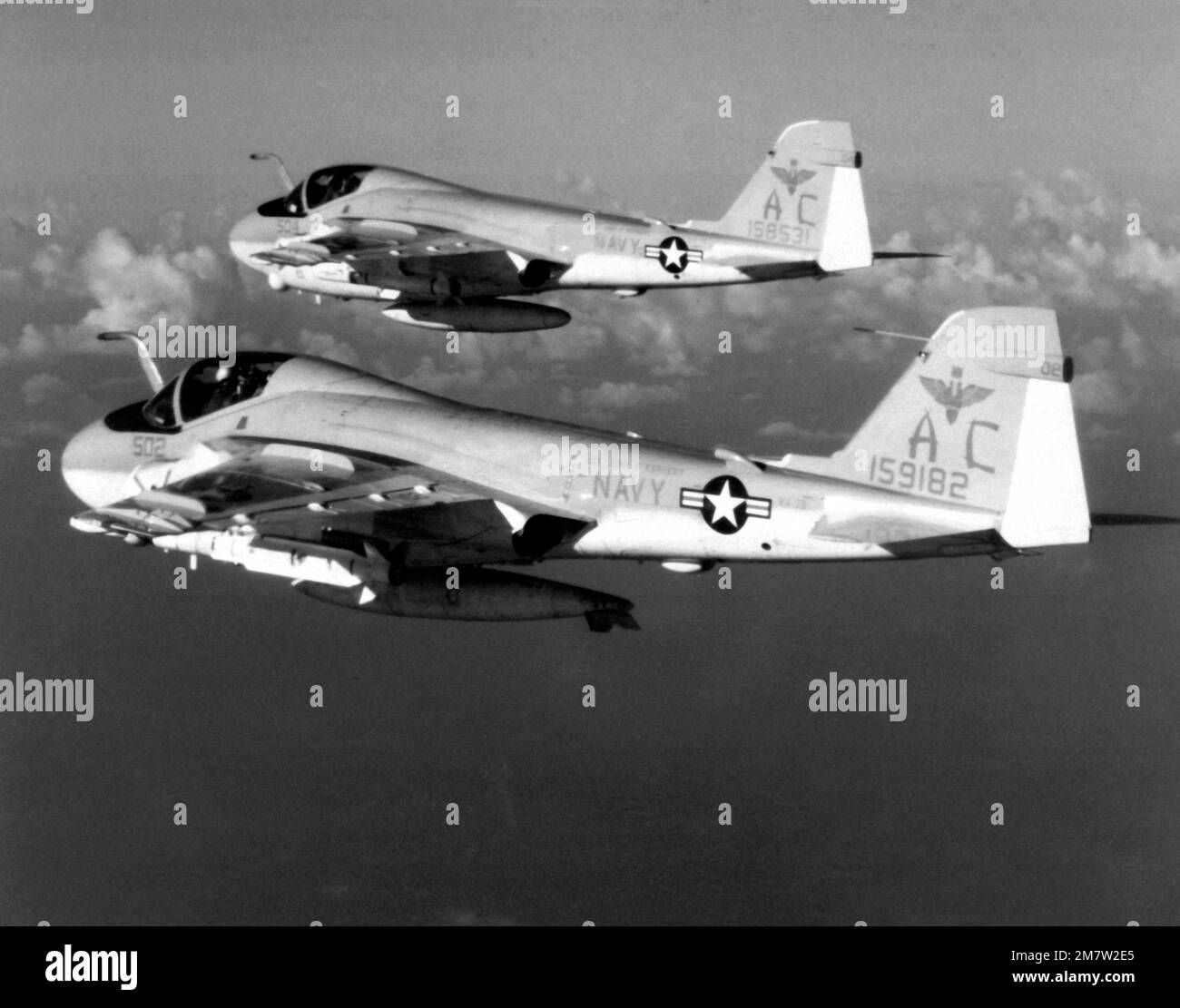 An air-to-air left side view of two A-6E Intruder aircraft from the ...
