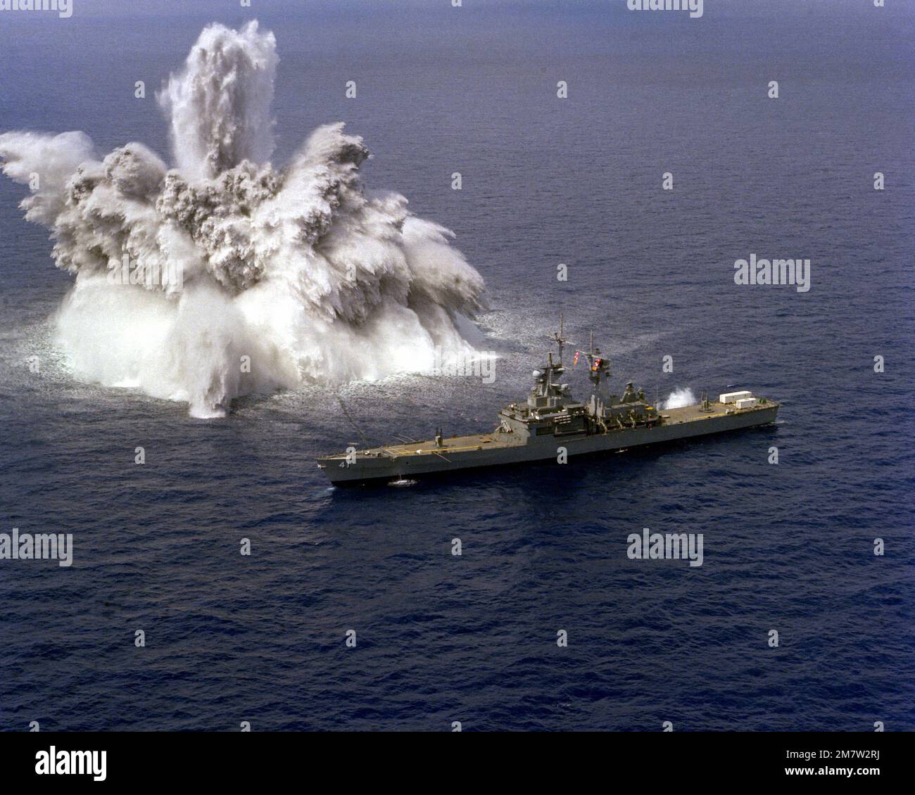 An explosive charge is detonated off the starboard side of the nuclear ...