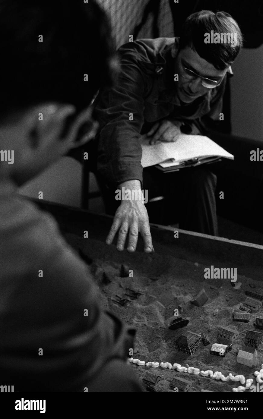 SSGT Mike Keffer, Co. C, 2nd Bn., 1ST Inf., is instructed on what to do ...