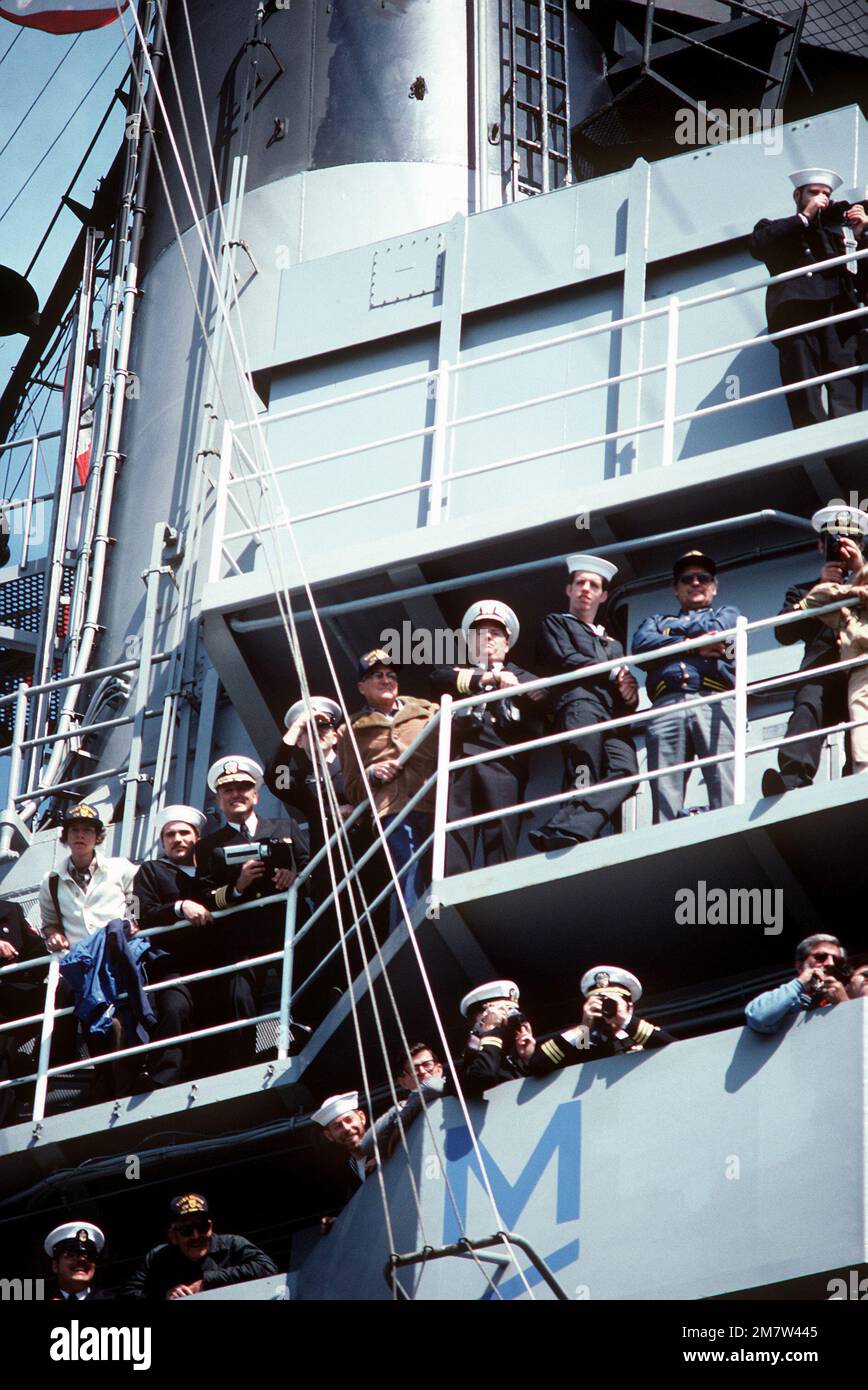 Crewmen aboard the aircraft carrier USS CORAL SEA (CV-43) man the rails ...