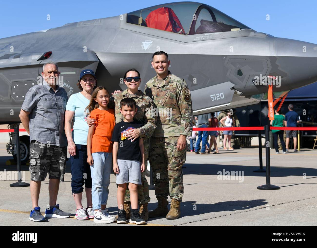 Airmen assigned to the 56th Fighter Wing pose with family in front of ...