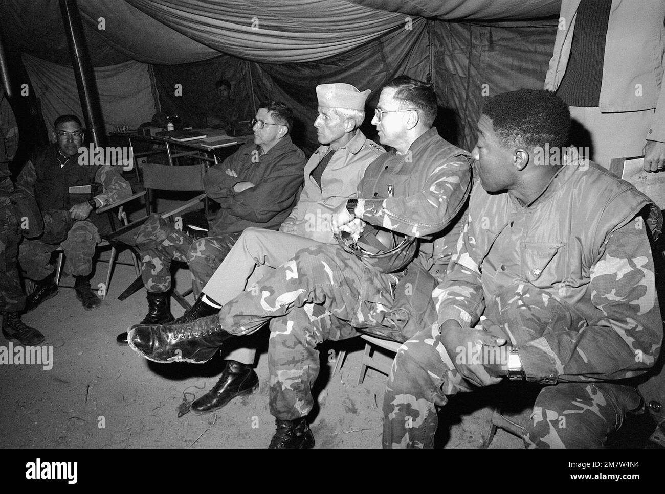 VADM M. Staser Holcomb, commander, 7th Fleet, attends a briefing of ...