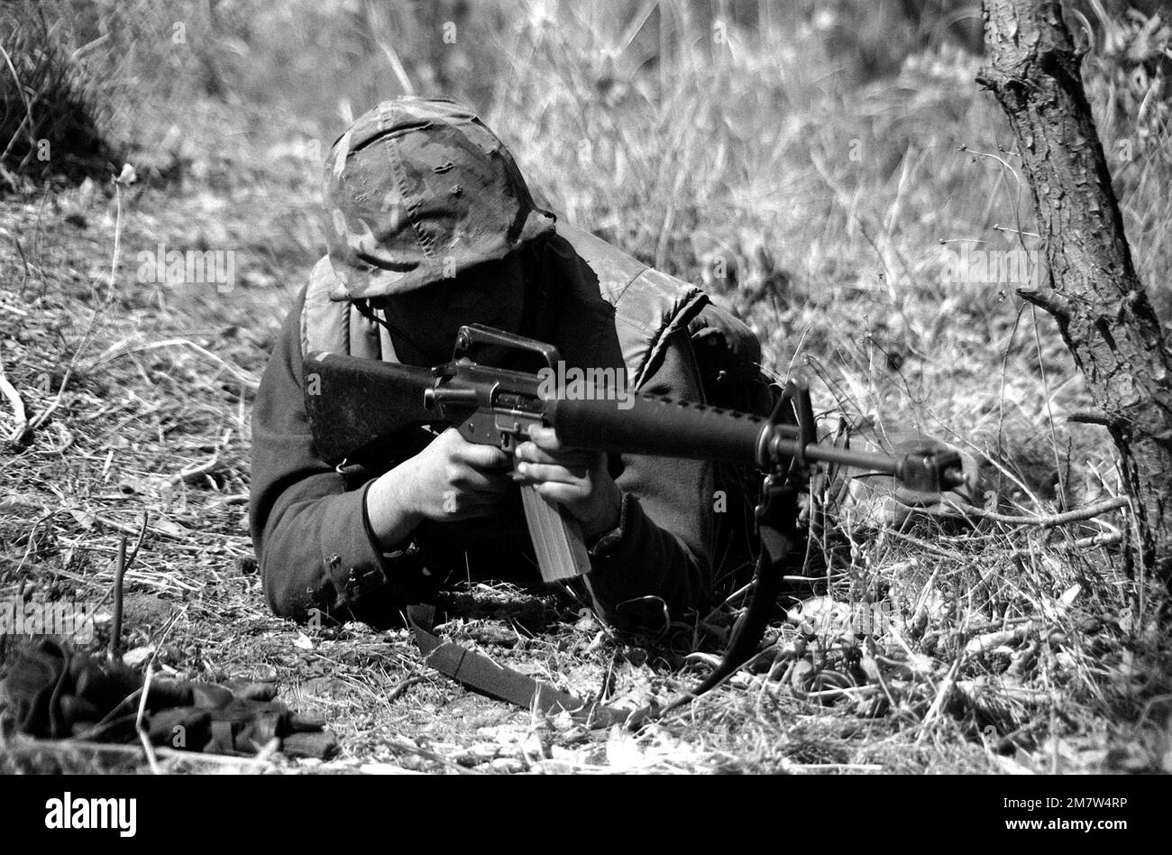 A U.S. Marine fires an M-16 rifle during exercise Team Spirit '82 ...