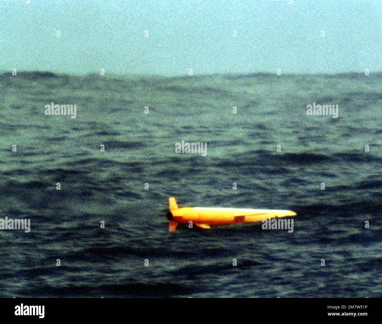 A view of a BGM-109 Tomahawk missile entering the water, during a land ...
