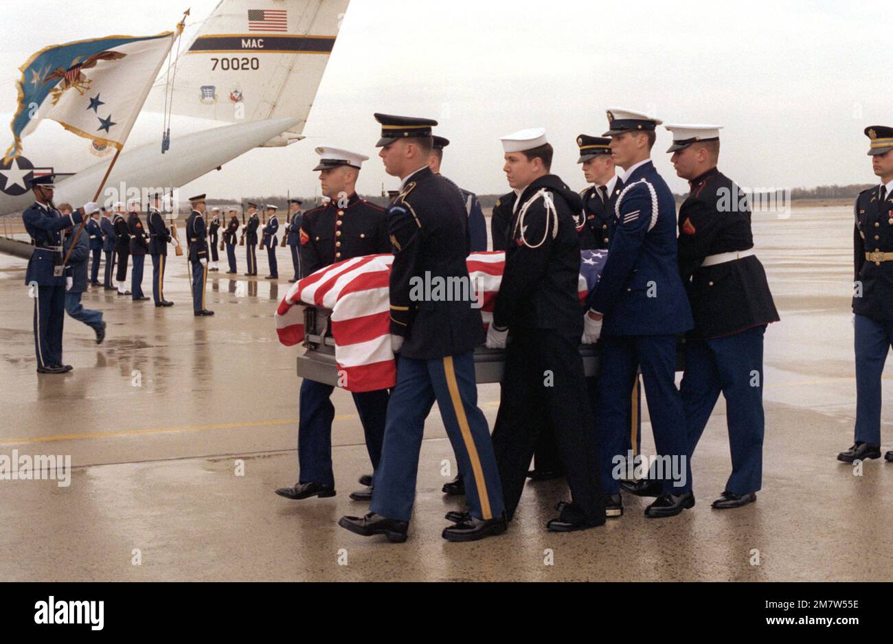 The remains of GEN Nathan F. Twining are being carried from a C-141 ...