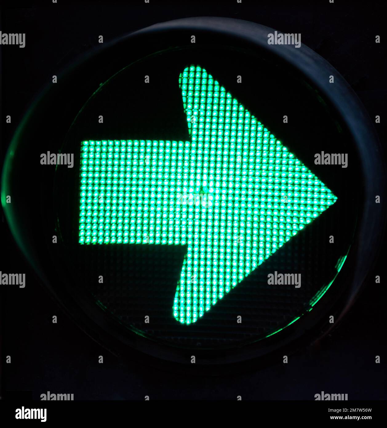 Right direction. Green arrow light on traffic lights showing turn right ...