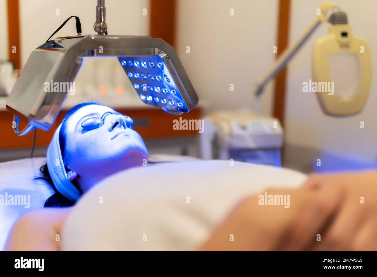 Facial treatment with led therapy. Girl on a light therapy procedure ...