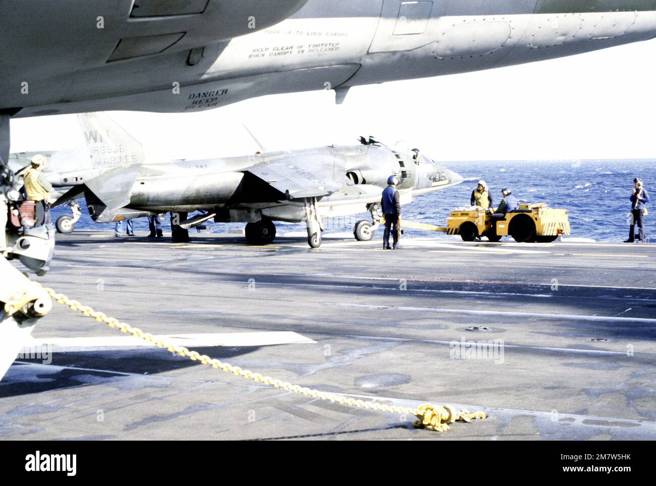 AV-8A Harrier aircraft are positioned on the deck of the amphibious ...
