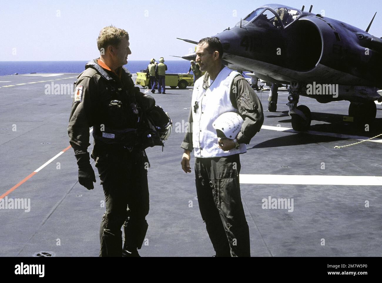 Two Marine pilots take a moment to talk after completing a flight from ...
