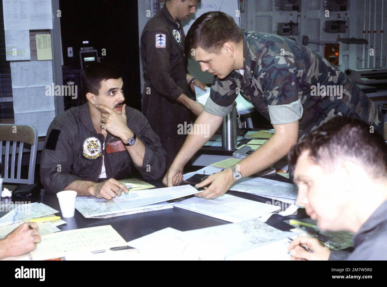 Marine pilots are briefed prior to flight operations aboard the ...