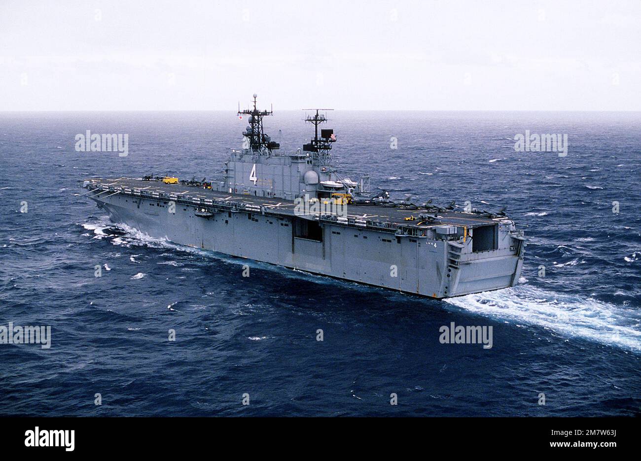 An aerial port quarter view of the amphibious assault ship USS NASSAU ...