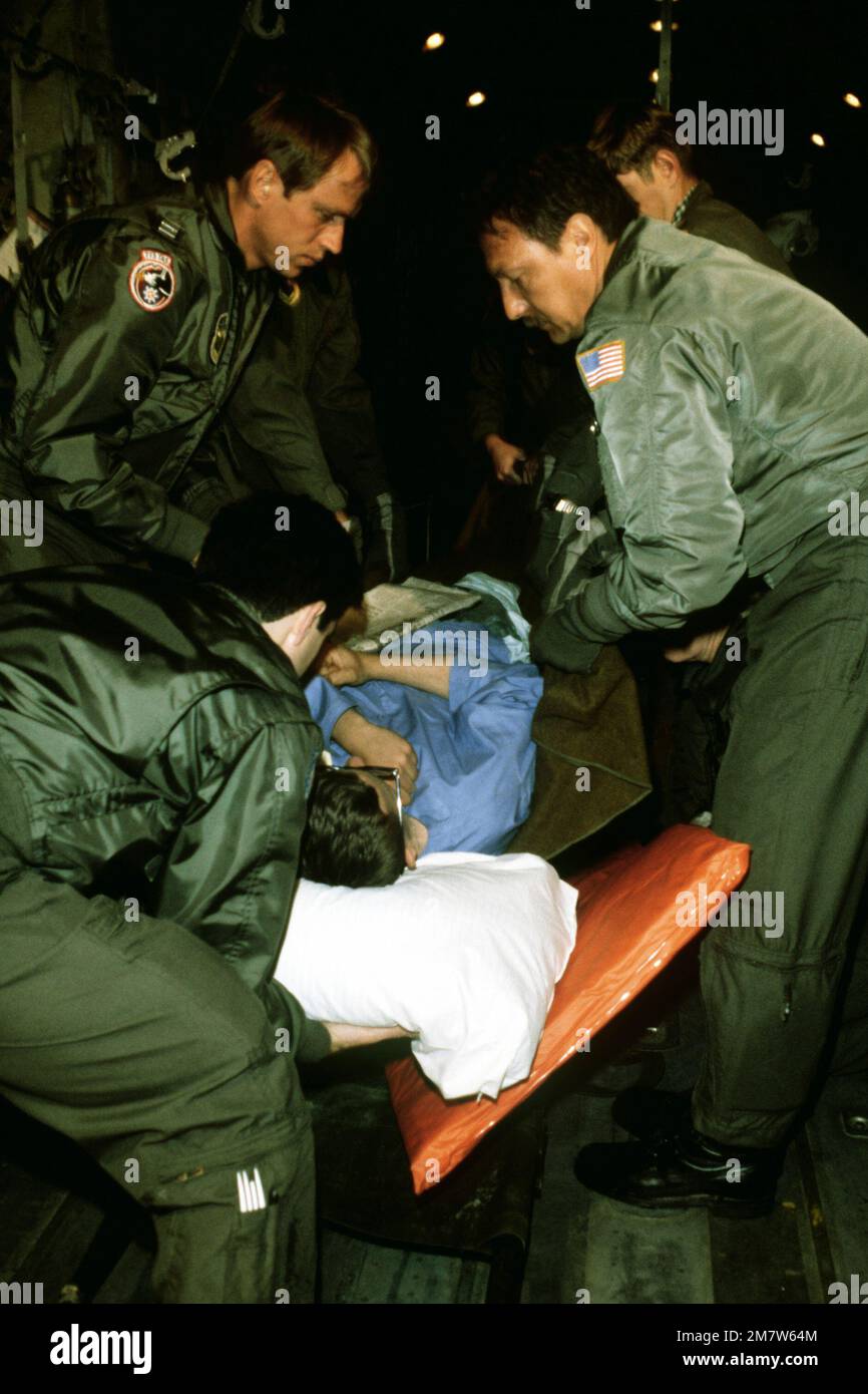 A member of the 82nd Airborne Division, injured in an air drop, is ...