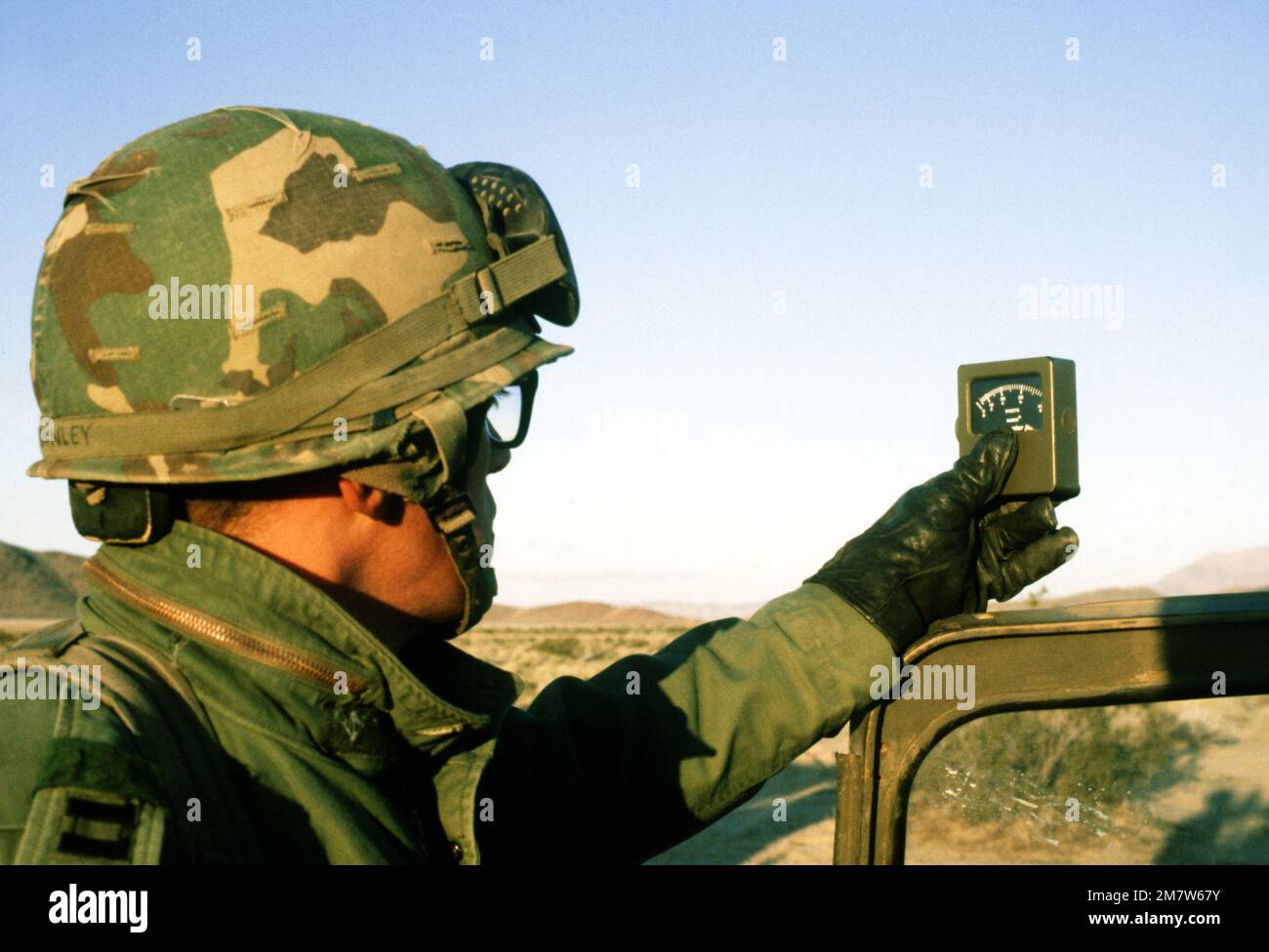 CPT Jim Danley, 82nd Airborne Division, uses a meter to check the wind ...