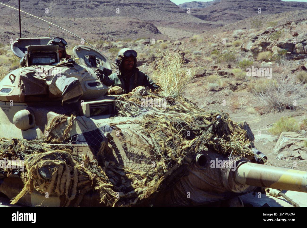 Marines aboard an M-60 tank participate in combat exercises during ...