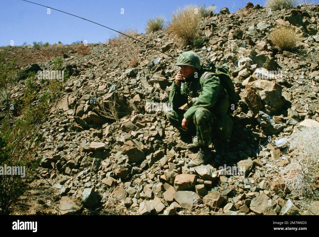 A Marine participating in combat exercises communicates with his ...