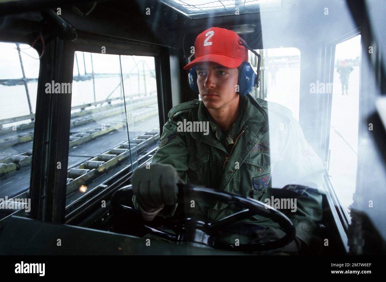 A member of the 2nd Mobile Aerial Port Squadron (MAPS) drives a 25 K ...