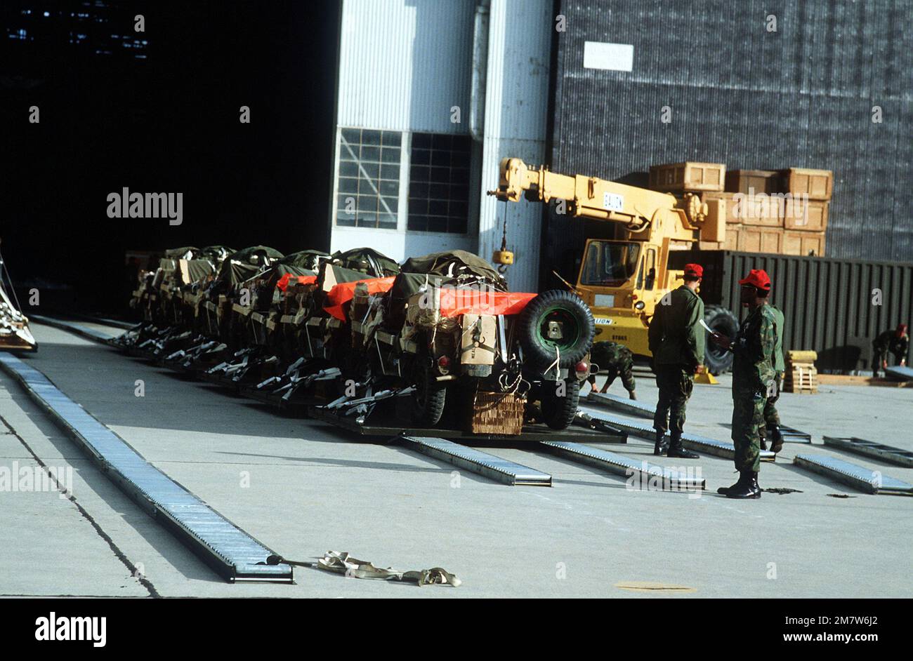 Cargo riggers from the 82nd Airborne Division prepare cargo for the Low ...