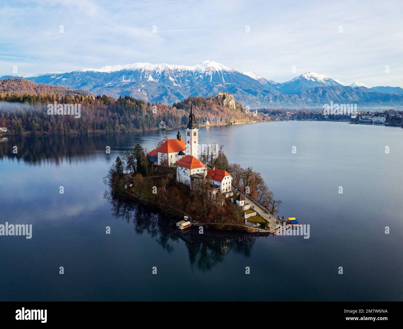 Aerial drone view of sunrise winter scenery of magical Lake Bled in ...