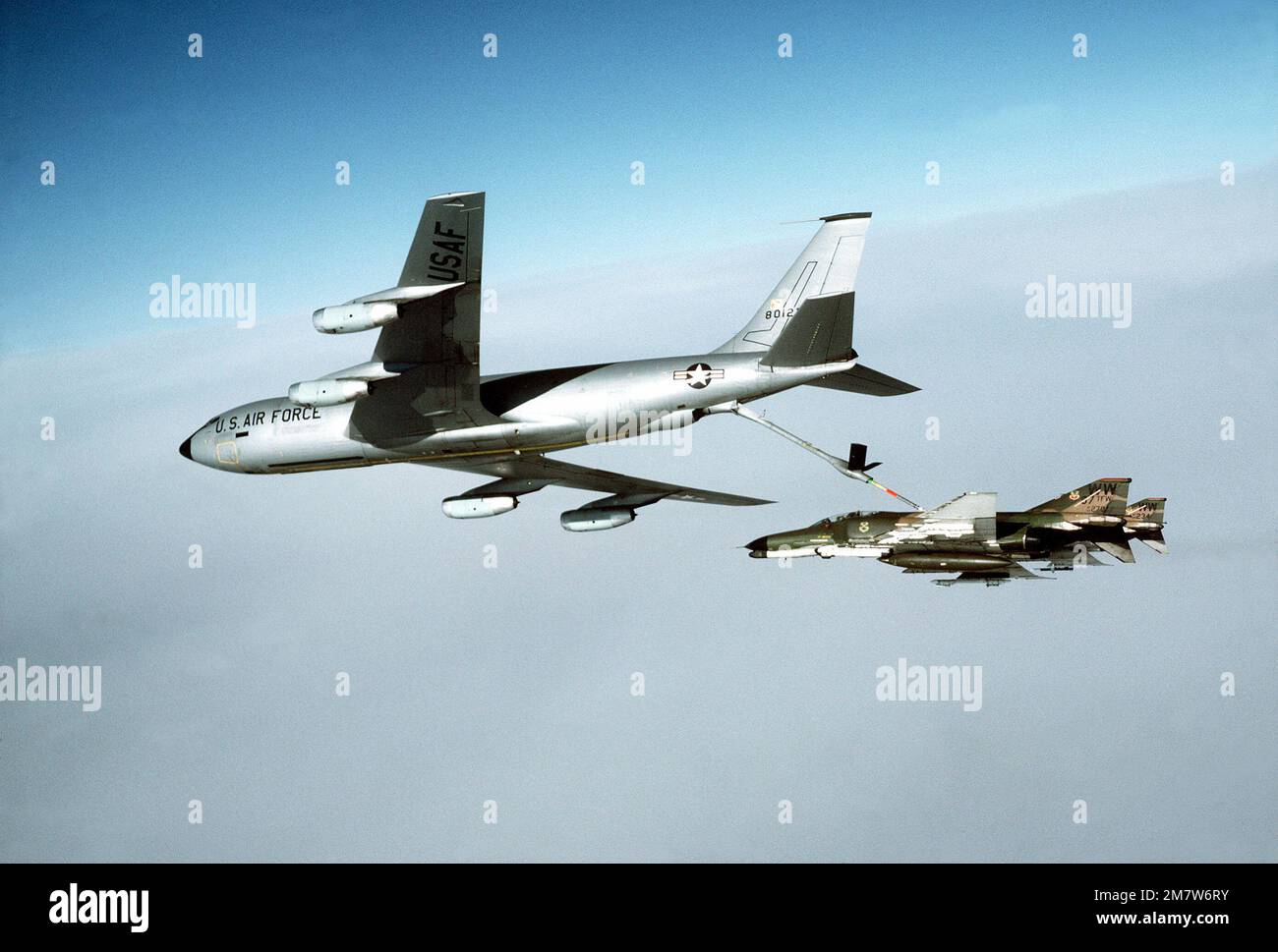 An air-to-air left underside view of an F-4 Phantom II aircraft being ...