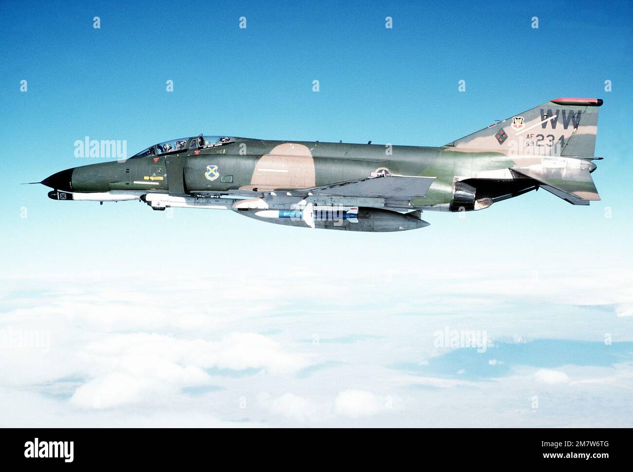 An air-to-air left side view of an F-4 Phantom II aircraft during ...