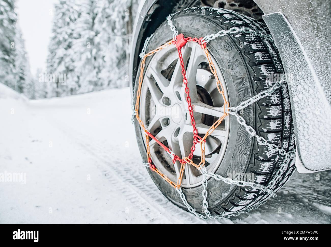 Car on icy road and chains hi-res stock photography and images - Alamy