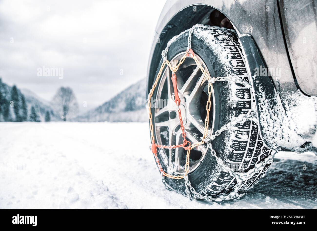 the chains snow for a wheel car on road in snowy country Stock Photo ...
