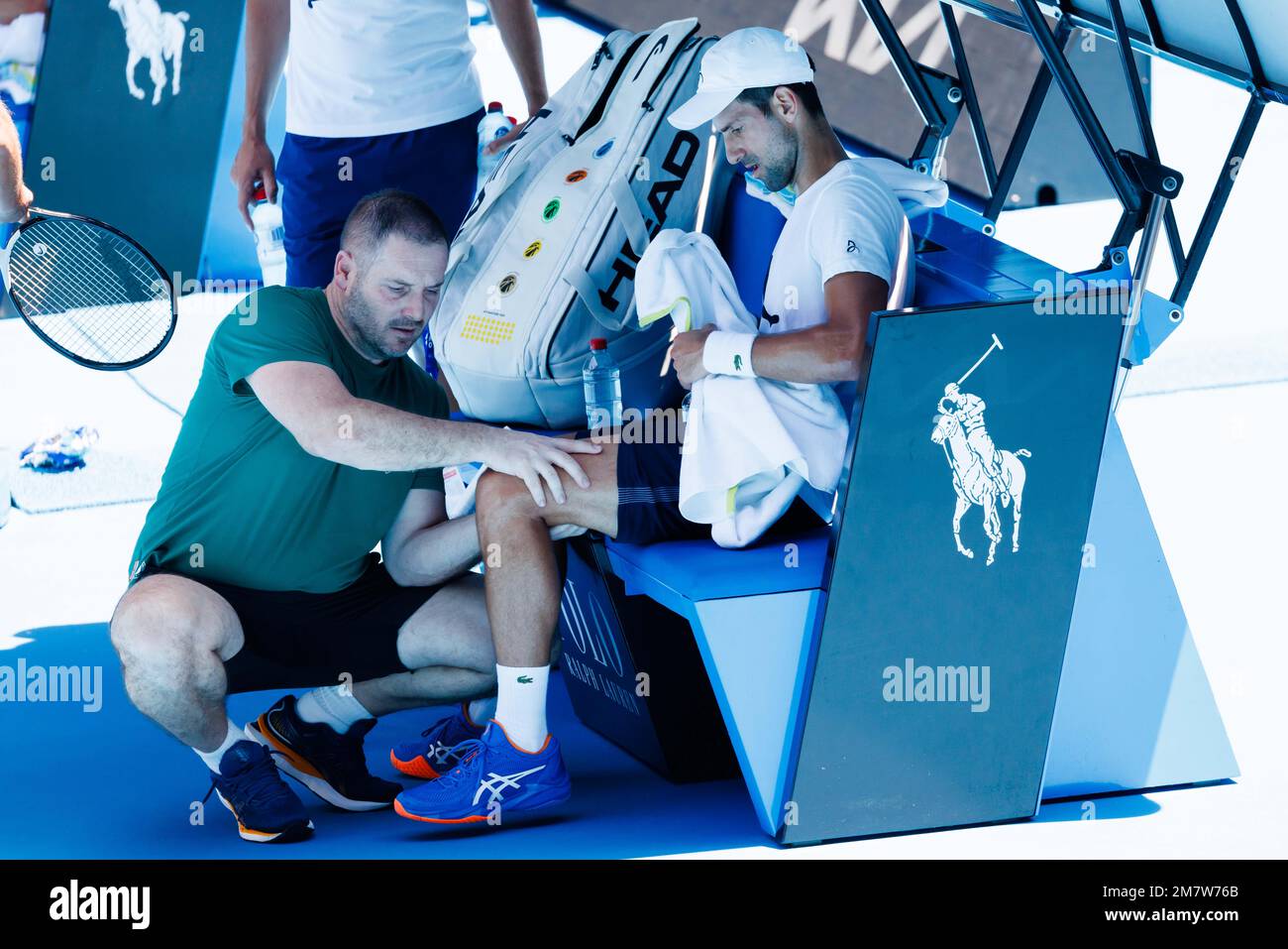 Melbourne, Australia. 11th Jan, 2023. Novak Djokovic receives treatment ...